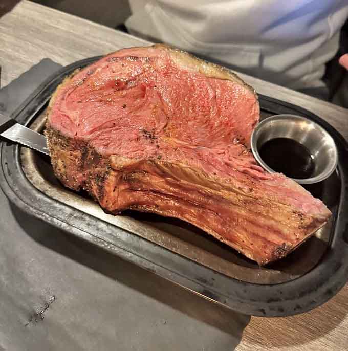 That prime rib arrives looking like it was carved by someone who genuinely respects the craft of cooking beef.
