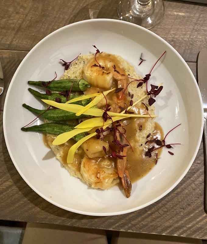 Plump shrimp, silky grits, creole cream sauce, and okra. This bowl is basically a love letter written in Southern.