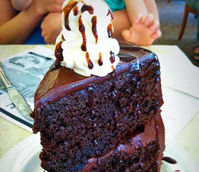 That dark chocolate cake isn't asking for your attention, it's demanding it, and winning.
