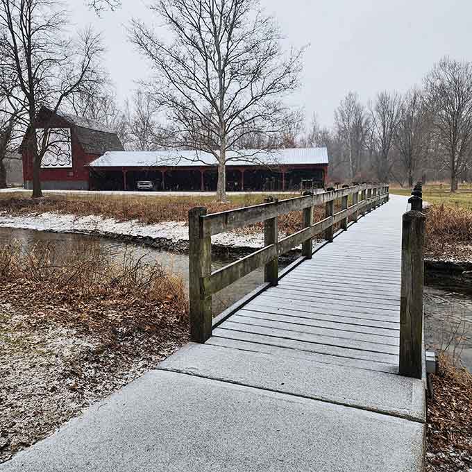 A wooden footbridge dusted with snow leads somewhere worth going. Winter at Bonneyville Mill has its own quiet magic.