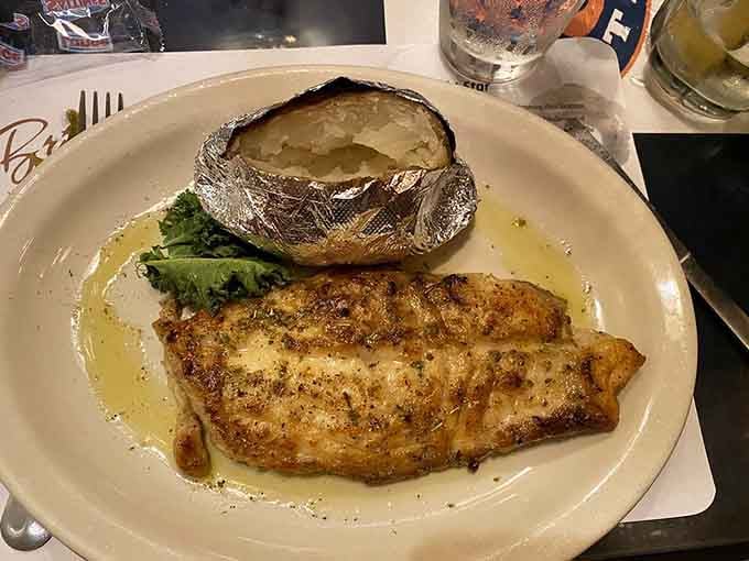 Golden, herb-kissed snapper with a baked potato on the side, simple, honest, and absolutely impossible to argue with.