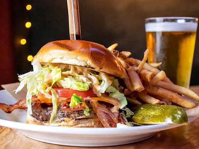 That burger towers with confidence, knowing it's about to make someone's day significantly better than it was.