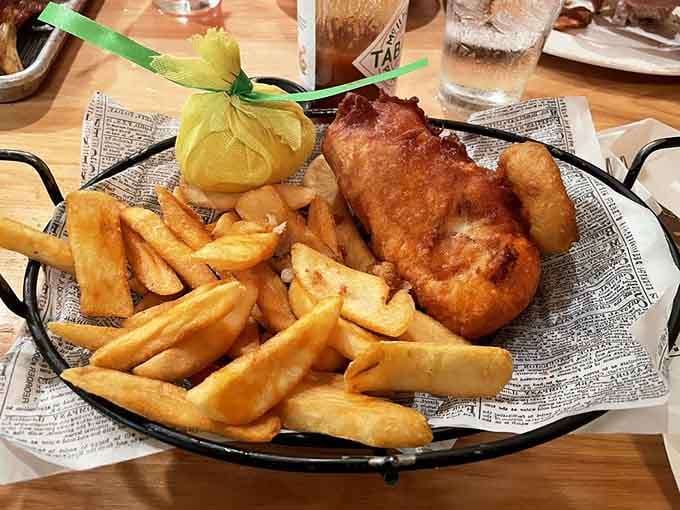 Golden, crispy, and served in a basket lined with newsprint — this Fish and Chips means every bite is front-page news.