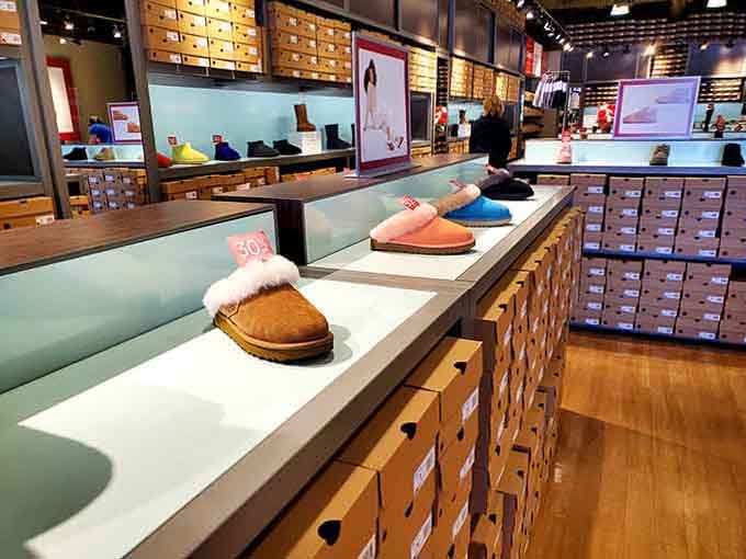 UGG slippers lined up like little fluffy soldiers, all waiting to go home with someone who deserves comfort.