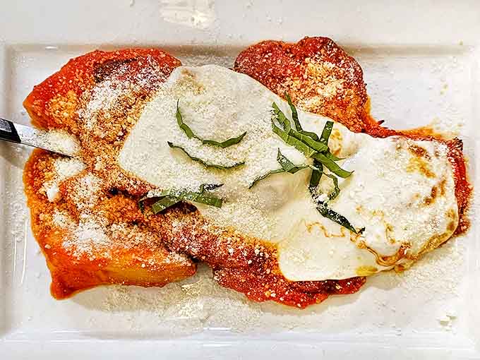 Golden-fried, blanketed in marinara, and crowned with melted mozzarella. This Chicken Parmesan means serious business.