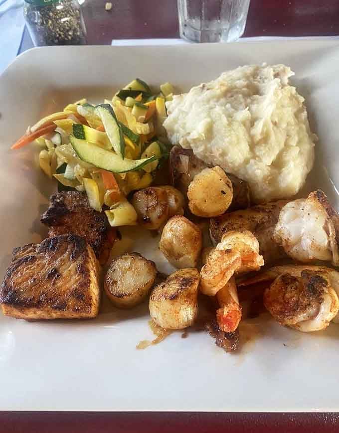 Shrimp, scallops, and fresh fish on one plate, this seafood platter is the ocean's greatest hits, live and in person.