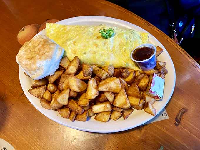 Fluffy, golden, and generously portioned, this omelet arrives like a warm hug you didn't know you needed.