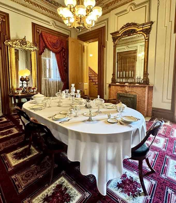The formal dining room is set so perfectly you half expect someone in Victorian clothing to pull out a chair.