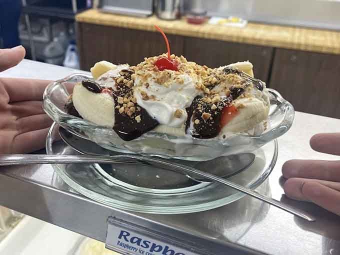 Crowned with a cherry, draped in chocolate sauce, and loaded with crushed nuts &mdash; this banana split is pure theater.