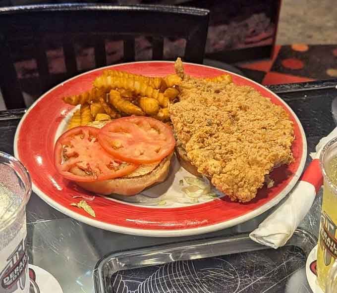 That crispy, golden pork tenderloin with fresh tomato and crinkle-cut fries. One look and you already know you're ordering seconds.