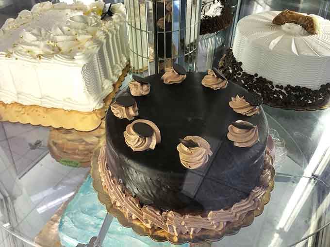 The display case lineup looks like the dessert version of a beauty pageant, and everyone's a winner here.