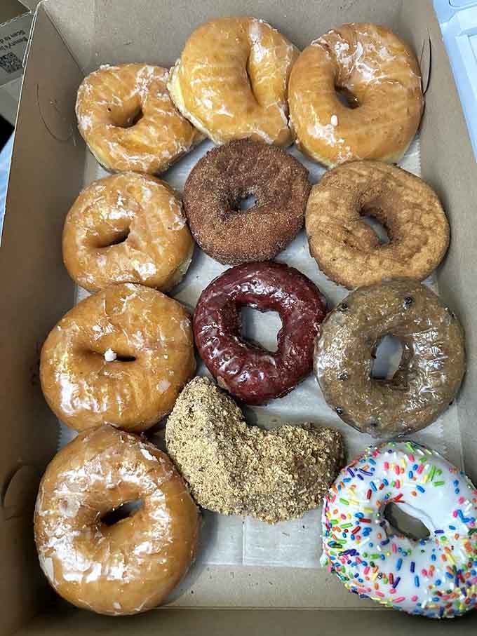 A dozen Dom Bakeries donuts in one box is basically a greatest hits album you can eat.