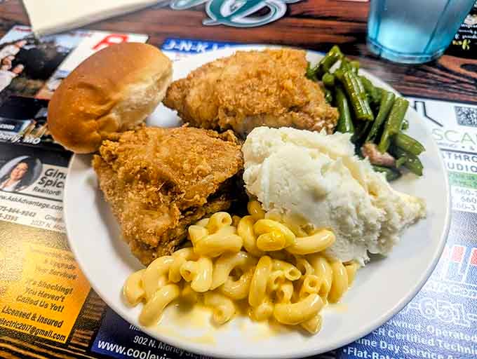 Fried chicken, mac and cheese, mashed potatoes, and green beans, this plate is a love letter to Missouri comfort food.
