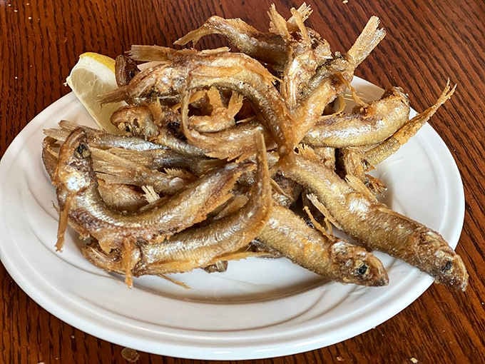 Crispy fried smelt with a lemon wedge. Simple, honest, and exactly the kind of snack the ocean ordered.