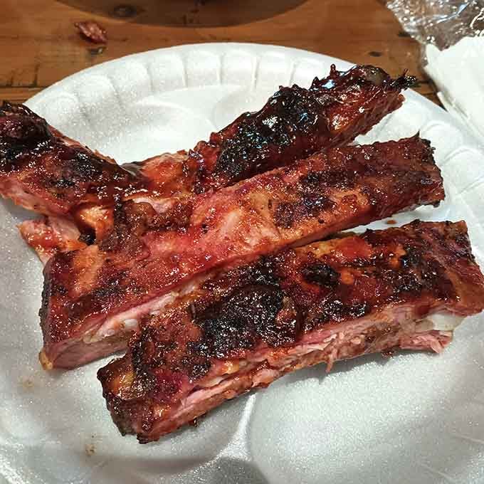 Those ribs have a bark so deep and rich, they look like they've been kissed by hickory smoke twice.