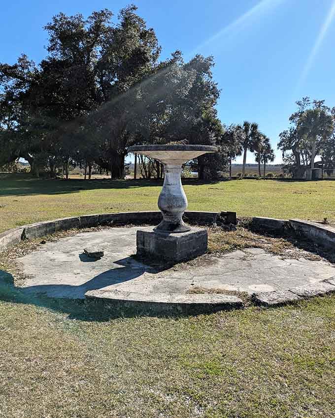 Even dry and forgotten, this old stone fountain carries the quiet dignity of a bygone era.