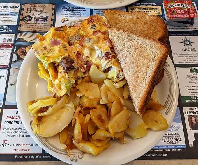 That omelet isn't just breakfast. It's a full commitment to starting your day exactly right, with home fries to match.