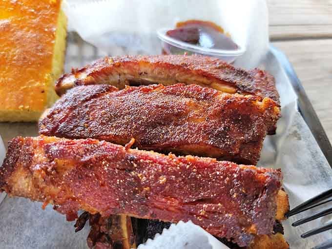 That deep mahogany bark on the ribs isn't decoration, it's a promise that something extraordinary happened inside that smoker.