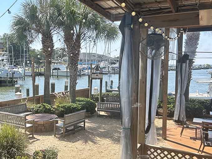 Sunset Pointe at Fly Creek Marina serves waterfront vibes alongside your meal, with sailboats thrown in for free.