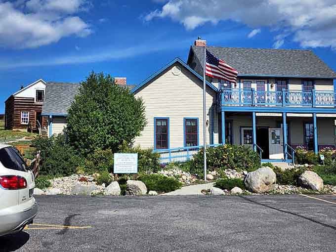 This visitor center welcomes you with classic mountain hospitality and an American flag that's seen some weather.
