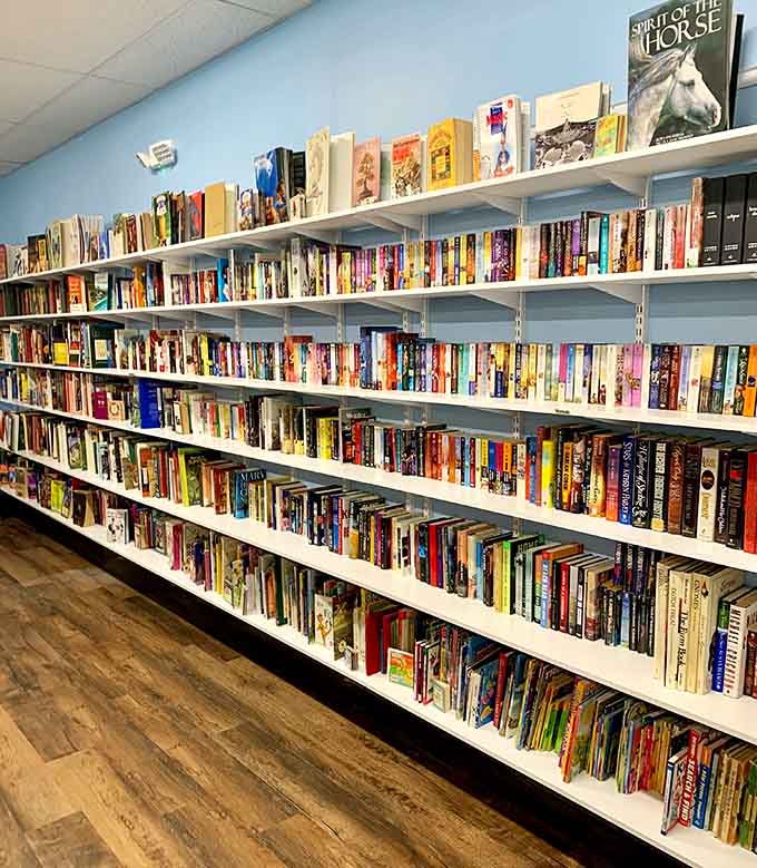 Floor-to-ceiling shelves packed with books. This is what a real reading list looks like, folks.
