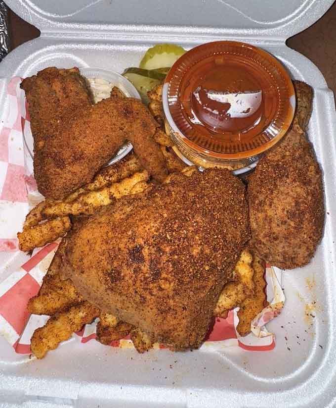 Three pieces of perfection nestled beside Cajun fries, proving that sometimes the universe does align in your favor.