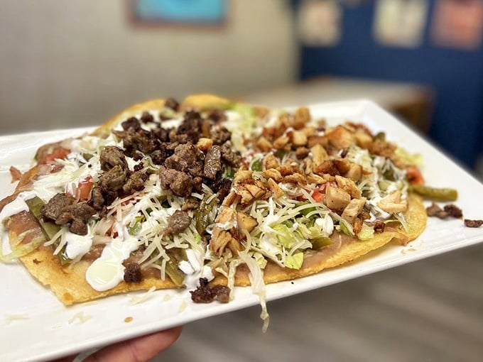 This huarache is loaded with refried beans, nopales, cheese, and meat, and it's absolutely meant to be eaten immediately.