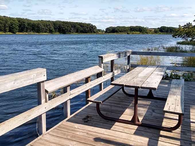 Perfect spot for contemplating life's mysteries while dangling your feet over water that reflects pure Minnesota tranquility.