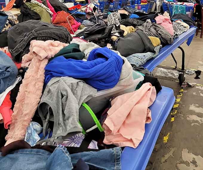 Layers upon layers of clothing spill over the bins, hiding gems that patient hands will absolutely find.