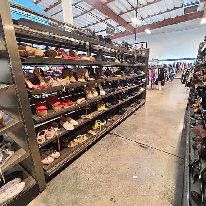 Row after row of shoes in every style imaginable, like a yard sale and a department store had a very productive afternoon together.