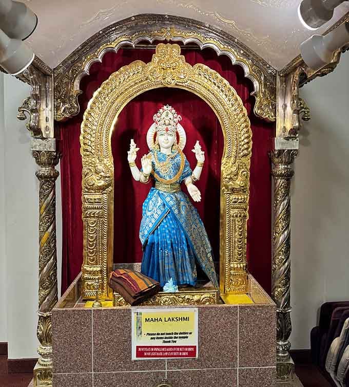 Maha Lakshmi, adorned in brilliant blue silk and gleaming gold, watches over this corner of Ohio with quiet grace.