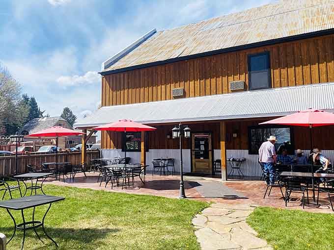 Red umbrellas, stone pathways, and cowboys on the patio prove that outdoor dining doesn't need a city zip code.