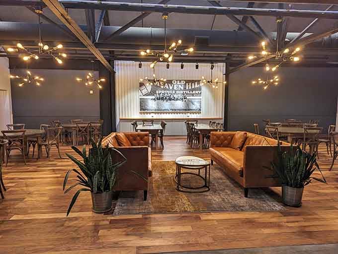 Warm leather sofas, string lights, and the ghost of Old Heaven Hill Springs Distillery watching over the room.