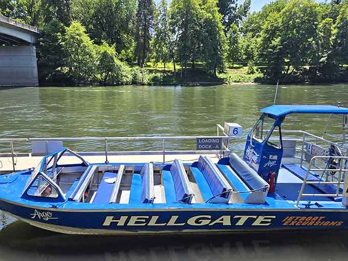 The distinctive blue boats waiting at the dock are your tickets to an unforgettable ride through nature's masterpiece.
