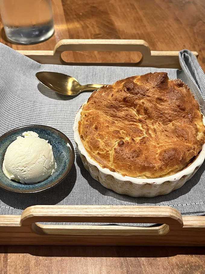 That golden, puffed spoonbread arriving tableside is basically Kentucky saying, "You're welcome, and also, sit down."