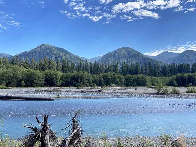 That glacier-blue water against forested peaks looks less like Washington and more like a screensaver you'd actually believe.