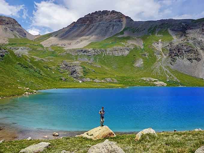 Standing on a rock above Ice Lake, this hiker looks exactly like someone who just discovered their new favorite place on Earth.