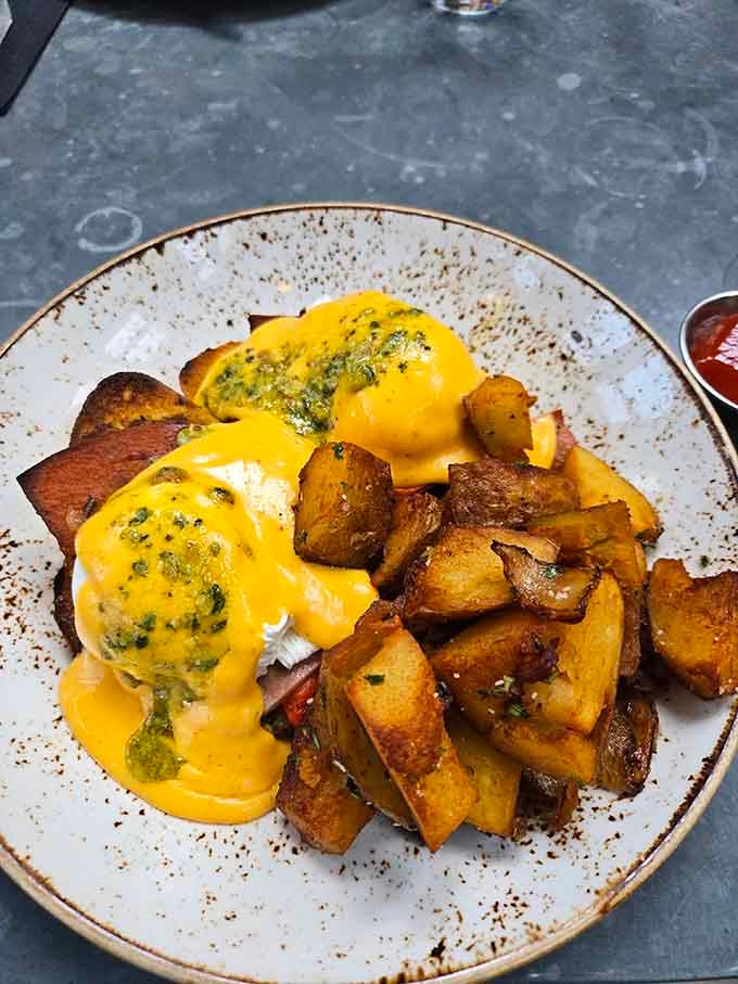Eggs Benedict so gloriously sauced and golden, you'll forgive yourself for ordering it before noon without hesitation.