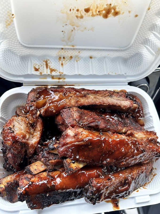 Glossy, sauced, and stacked high, these ribs are the reason people drive past three other exits.