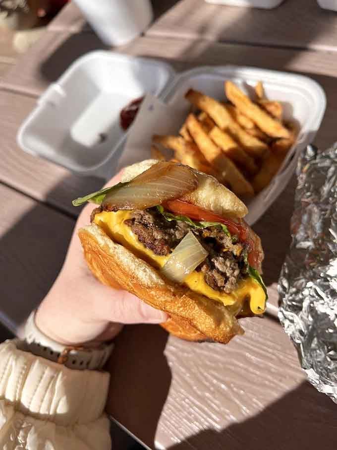 Look at that perfectly grilled patty with caramelized onions and melted cheese begging you to take a bite.