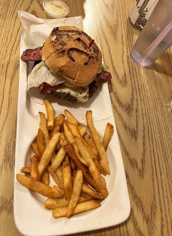 This burger comes with bacon and char marks that look like they were applied by someone who truly cares.