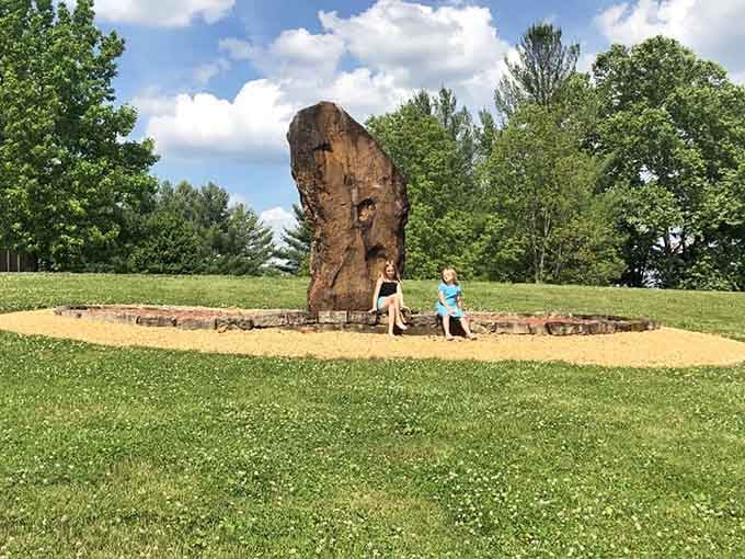Even the kids know something special is happening here. That giant stone has serious main character energy.