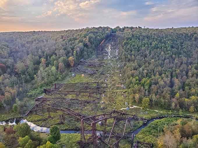 The fallen towers sprawl across the valley floor like a giant's discarded toys, beautiful in their destruction and decay.