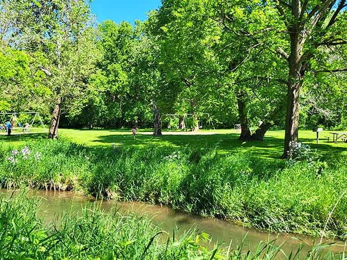 Swings, shade trees, and a lazy creek nearby, this is what a perfect summer afternoon actually looks like.