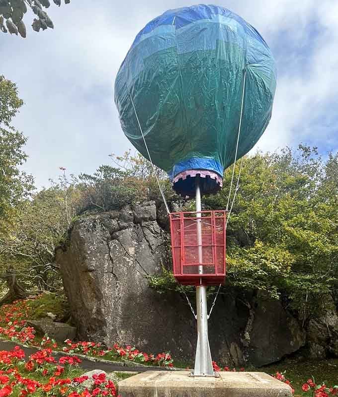The Wizard's hot air balloon, grounded but glorious, sitting pretty against the Blue Ridge Mountain sky.