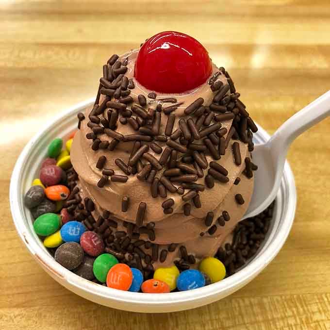 Chocolate soft serve crowned with sprinkles, M&Ms, and a cherry, this bowl means serious, joyful business.