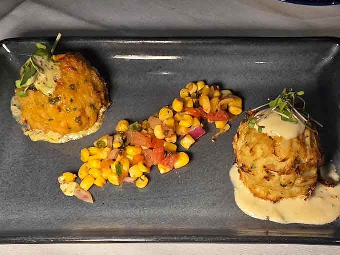 The Seafood Cake Duo arrives looking like a still life painting you'd rather eat than admire.