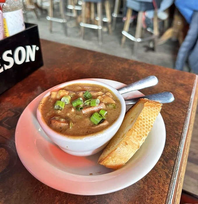 Lincoln's Roadhouse gumbo arrives rich, dark, and deeply fragrant, with a toast point that knows exactly what it's doing.