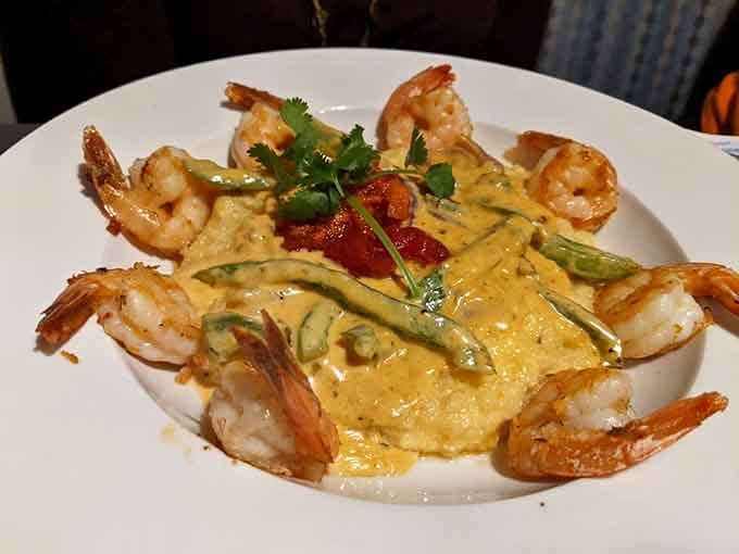 Creamy grits, plump shrimp, and a sauce that makes you forget what state you're in entirely.