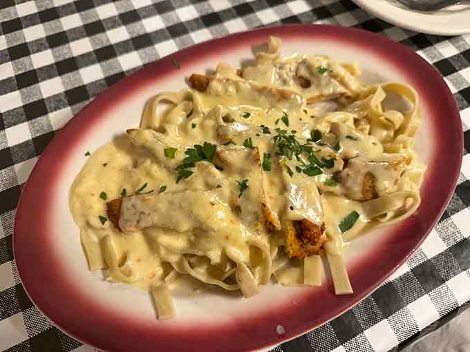 Mama Santa's Chicken Fettuccine Alfredo arrives like a creamy, golden dream that makes every diet negotiable.